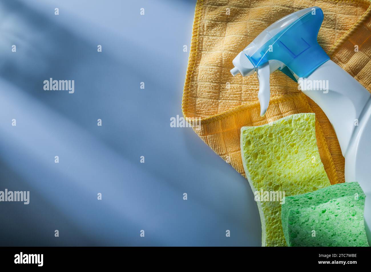 Composition of cleaning items on white surface Stock Photo - Alamy
