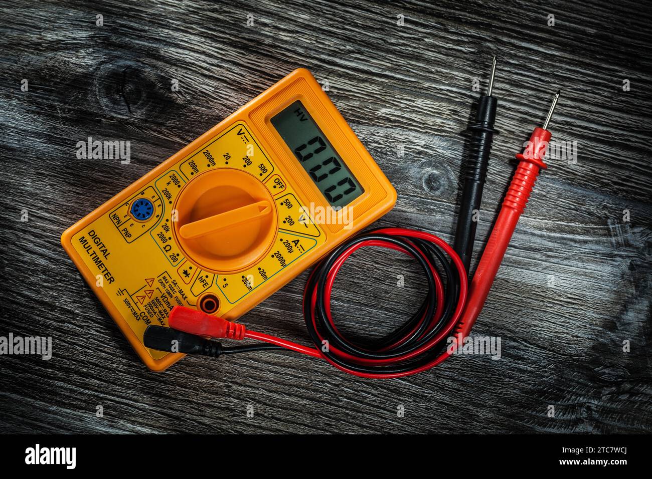 Electric multitester on vintage wooden board top view Stock Photo - Alamy