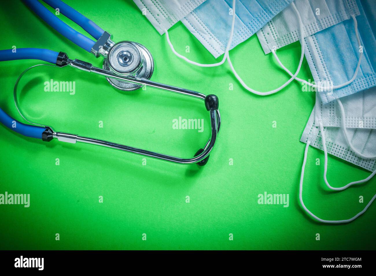 Medical stethoscope face masks on green background medicine concept ...