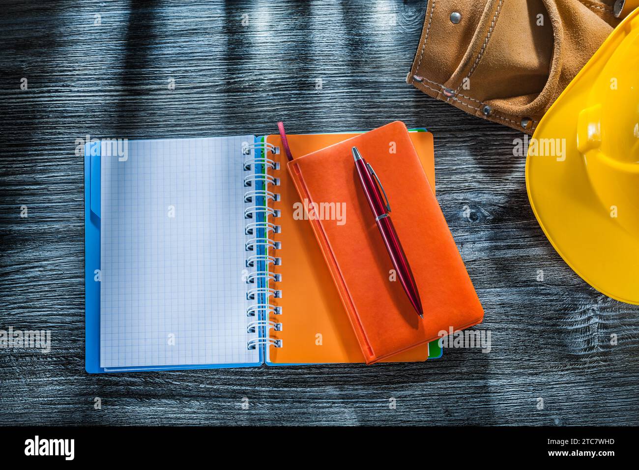 Notepads pen safety cap leather tool belt on wooden board Stock Photo ...