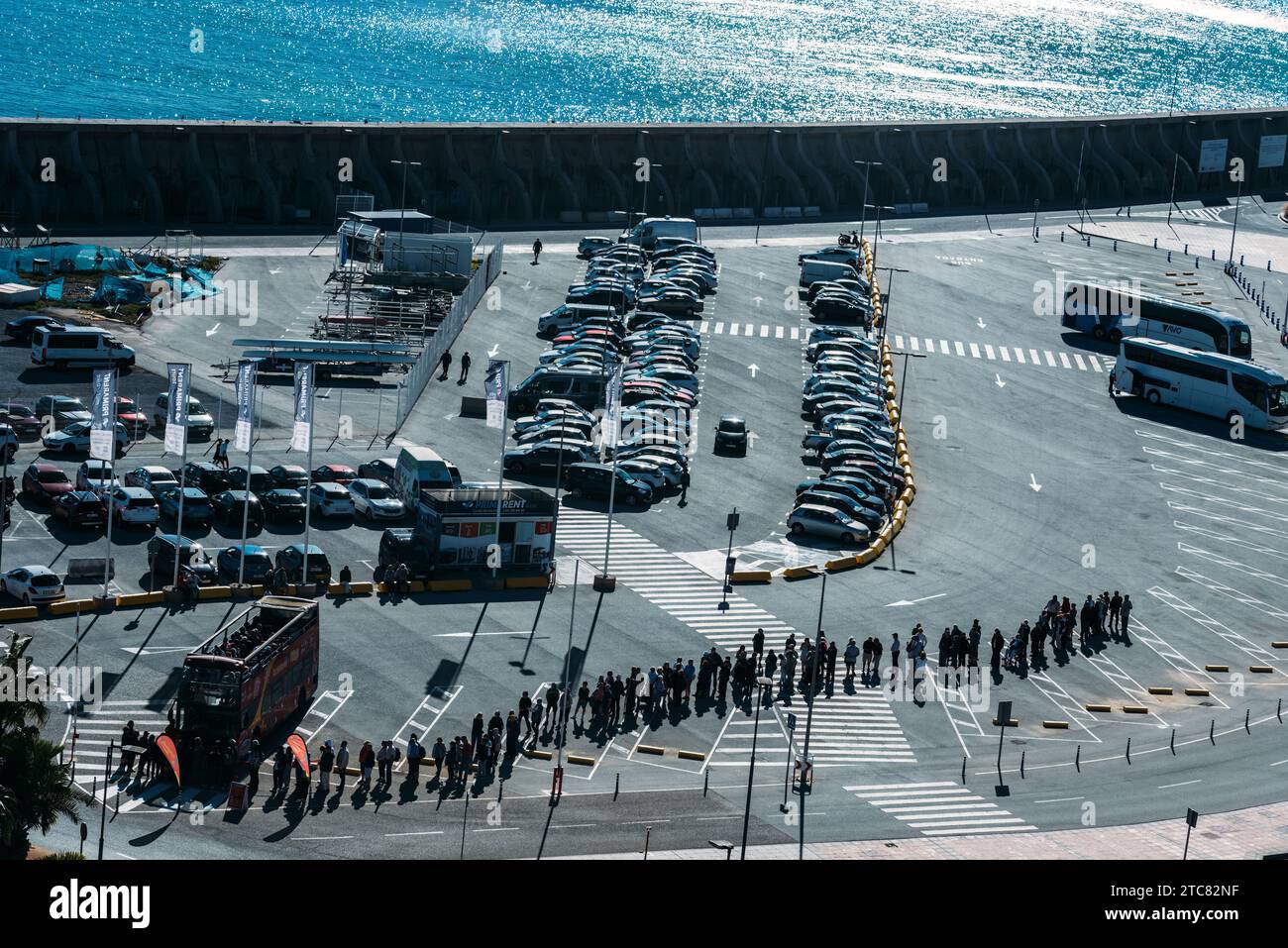 Malaga, Spain - November 22, 2023: Queue to board a double decker ...
