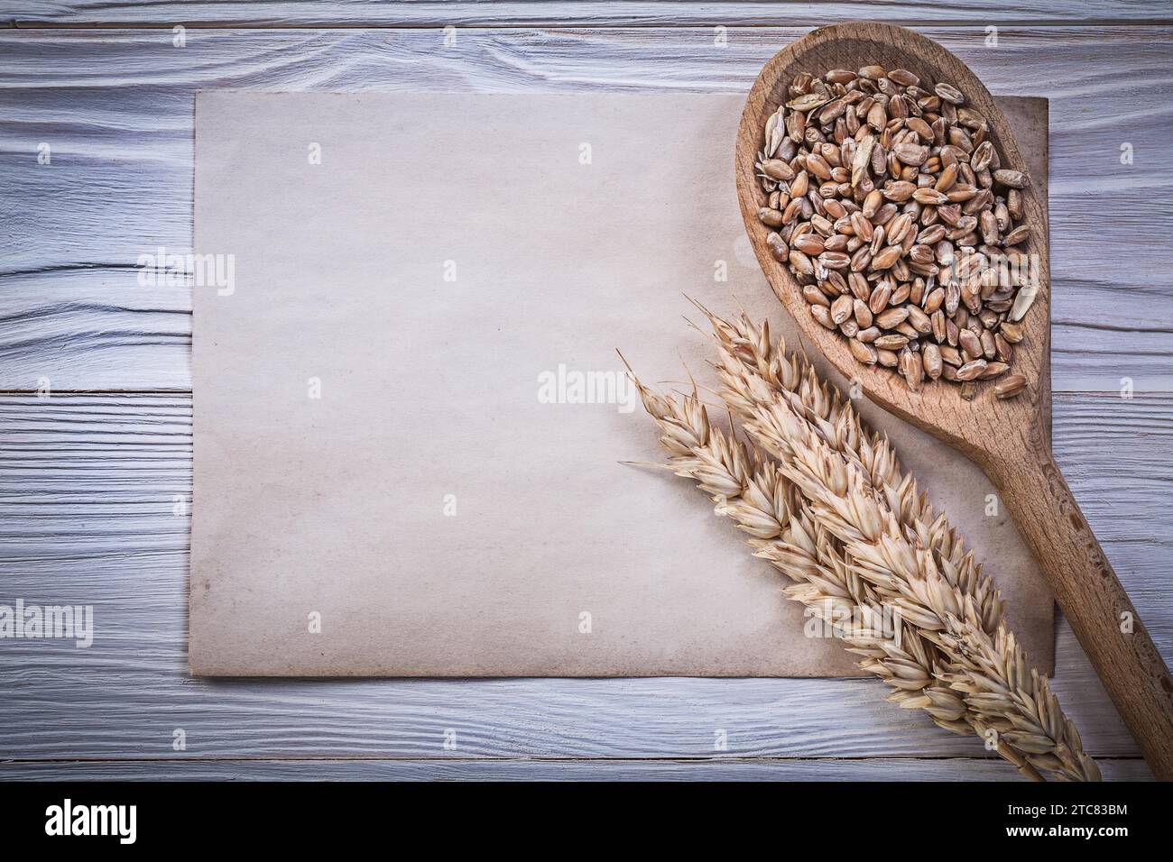 Wheat rye ears grain wooden spoon vintage paper on wood board Stock ...