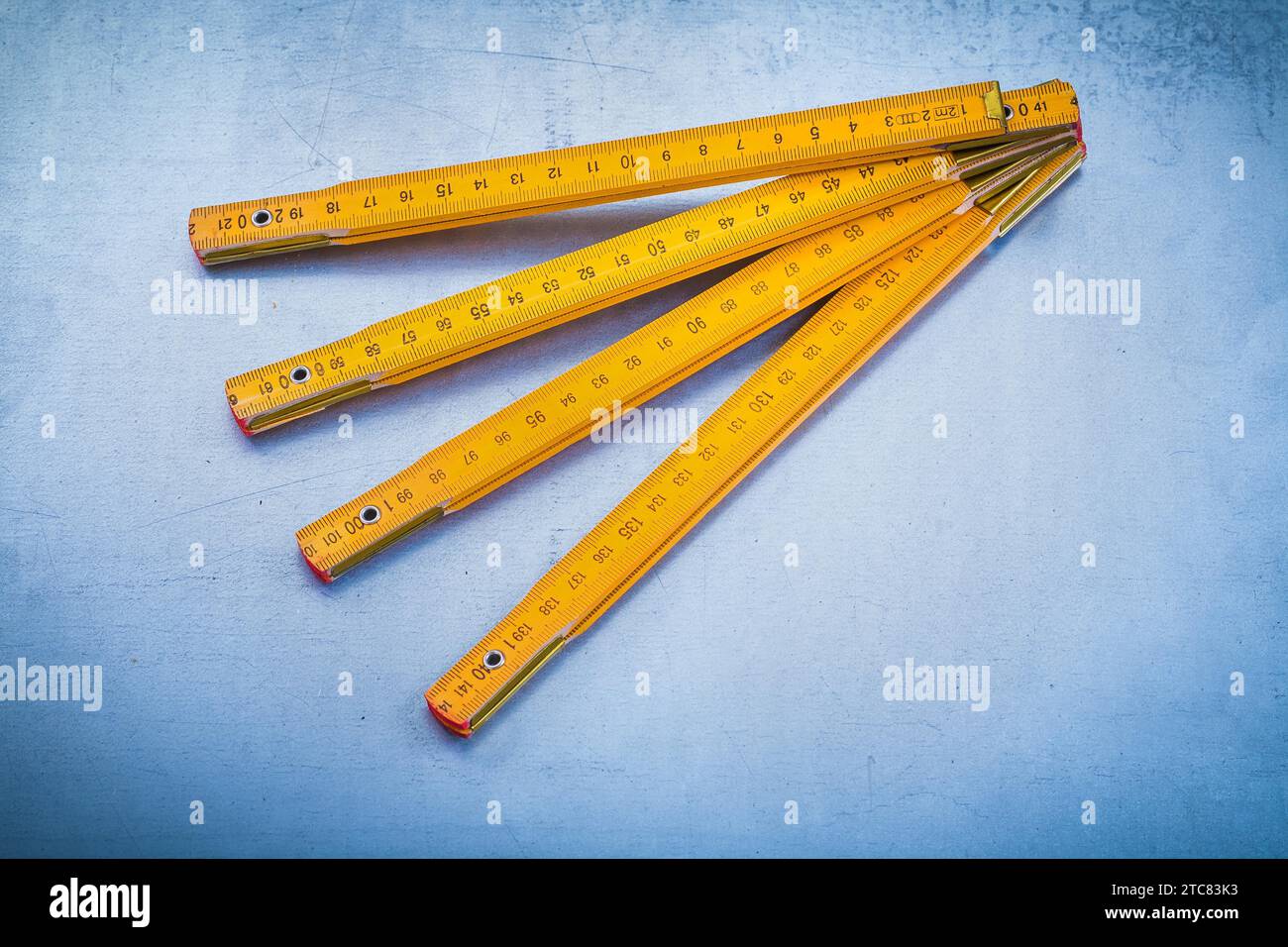 Yellow wooden meter on metallic background construction concept Stock ...