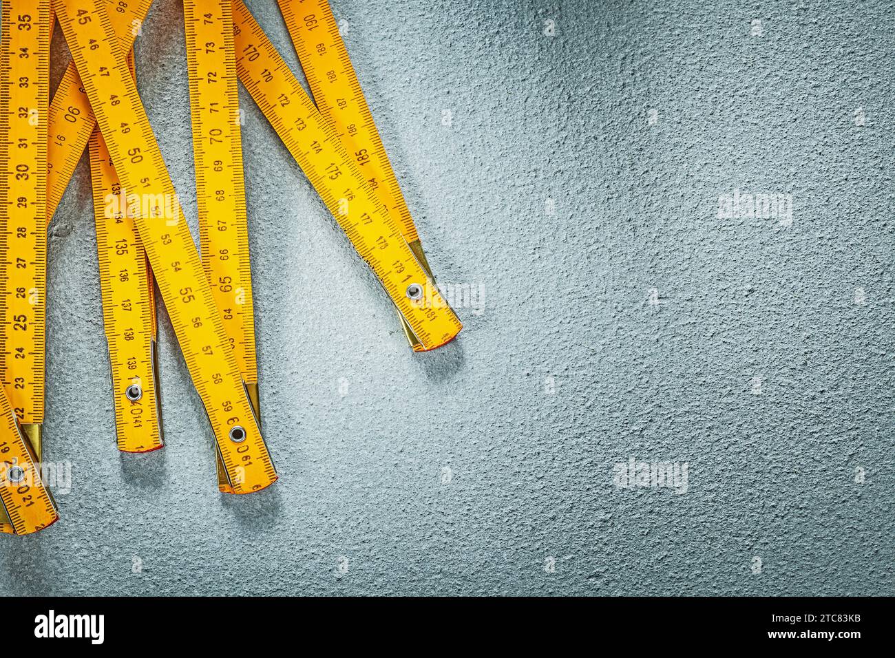 Yellow wooden meter on concrete background construction concept Stock ...