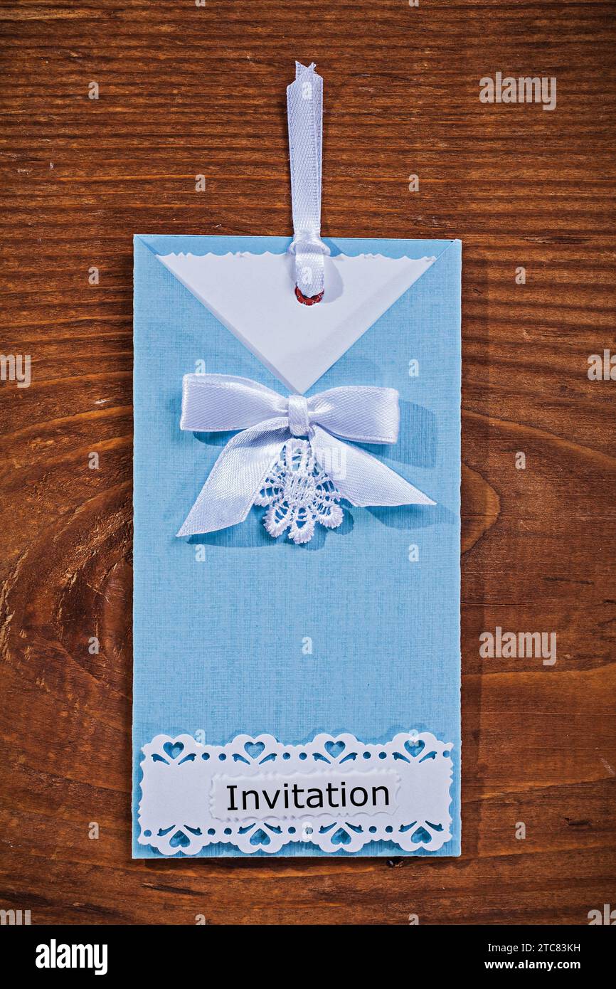 Beautiful handmade blue vertical invitation envelope on old wooden ...