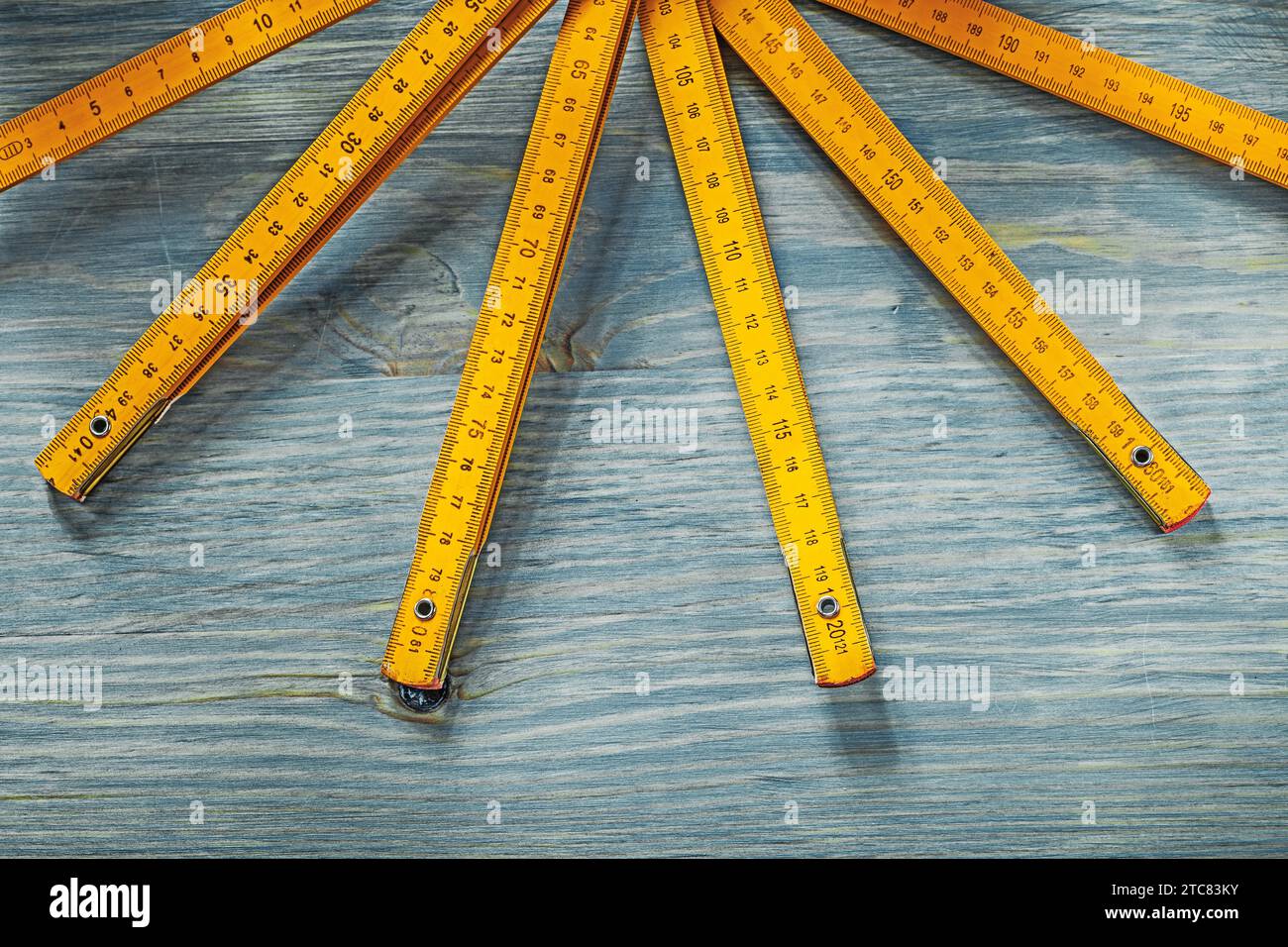 Yellow wooden meter on vintage wood background construction concept ...