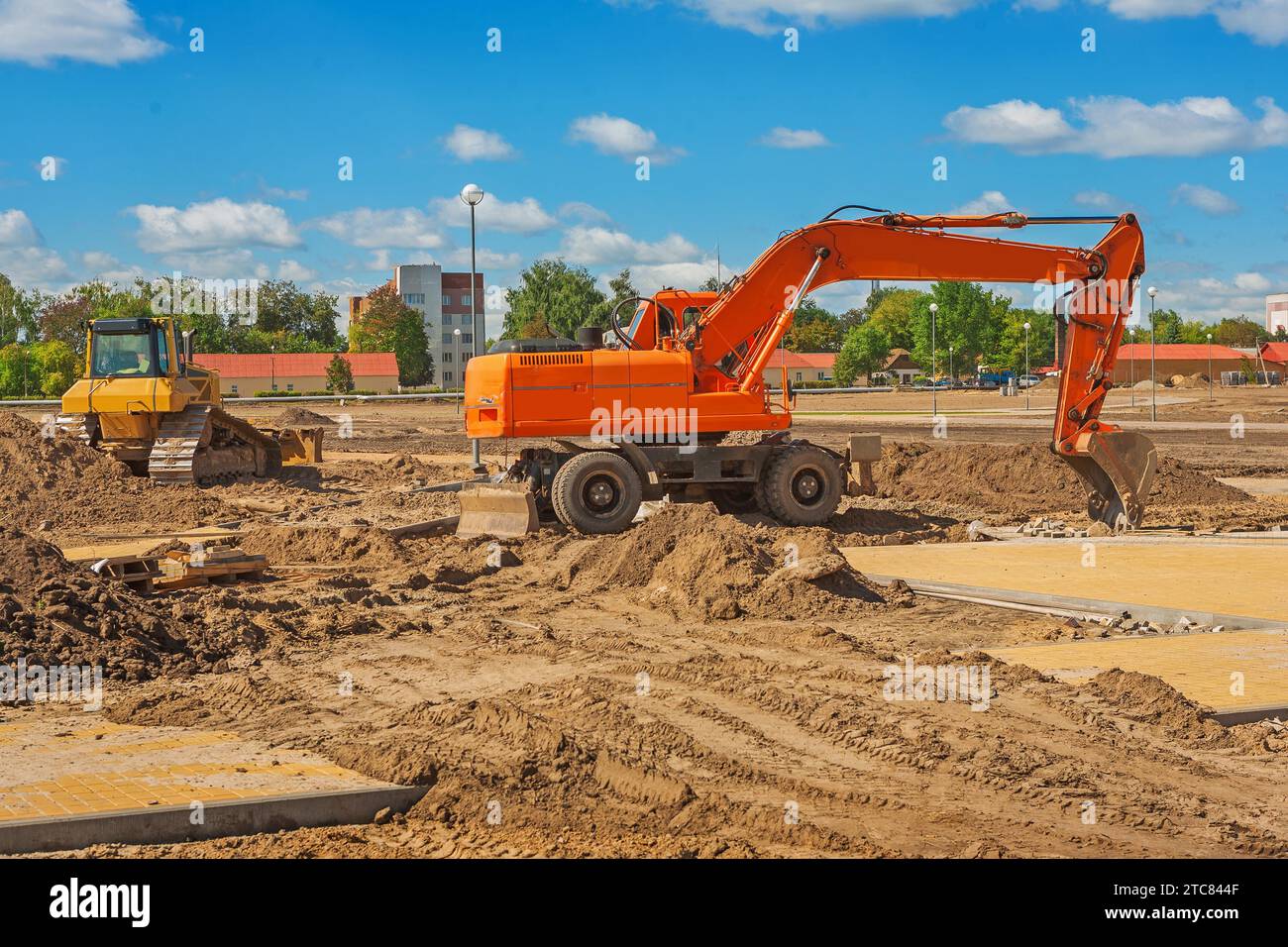 View on work of excavator on construction site Stock Photo - Alamy