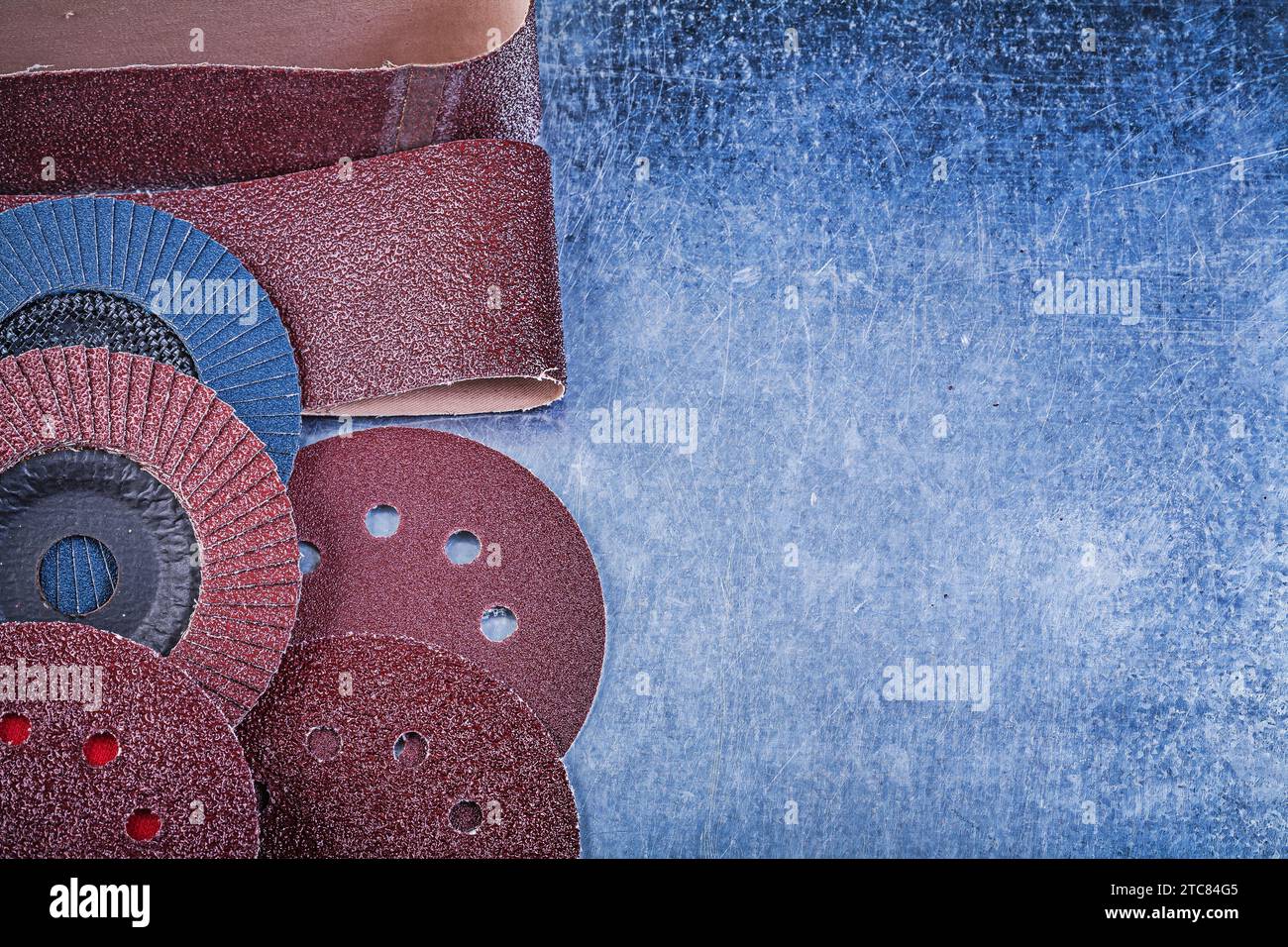 Glass-paper grinding discs abrasive flap wheels on metallic background ...