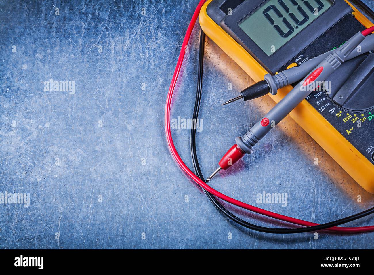 Digital electric tester on metallic background electricity concept ...