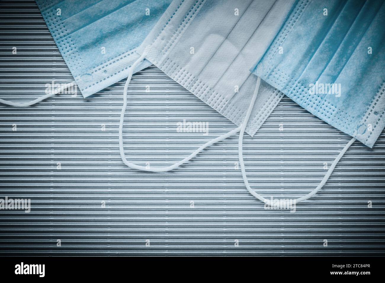 Medical disposable sterile masks on striped background top view Stock ...