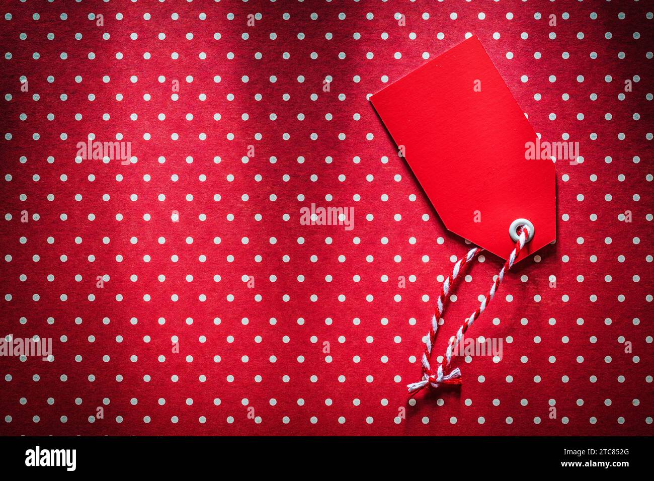 Red price label on polka-dot background Stock Photo - Alamy