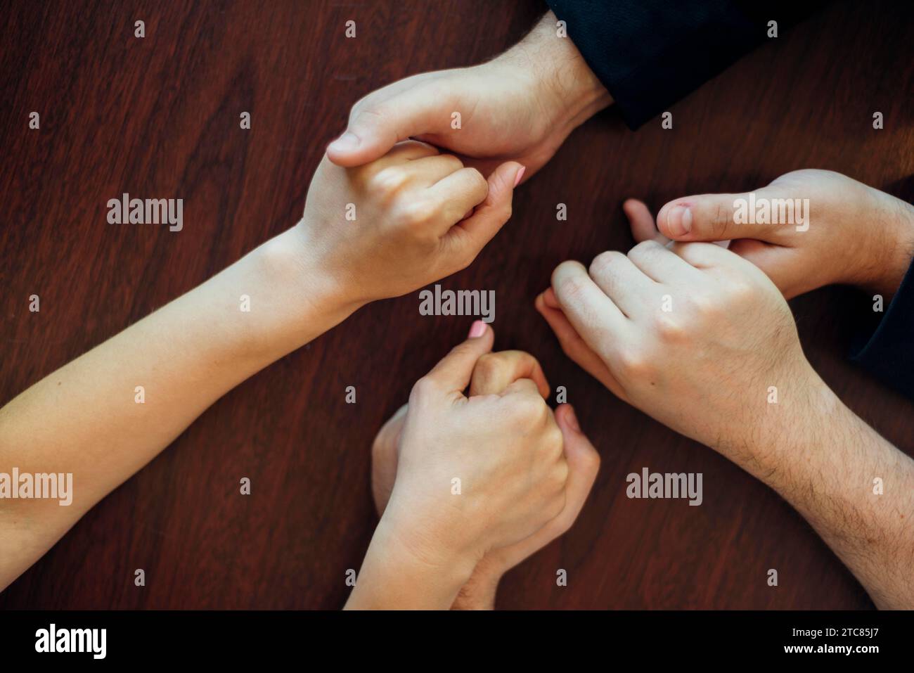 Group people holding each other hands Stock Photo - Alamy