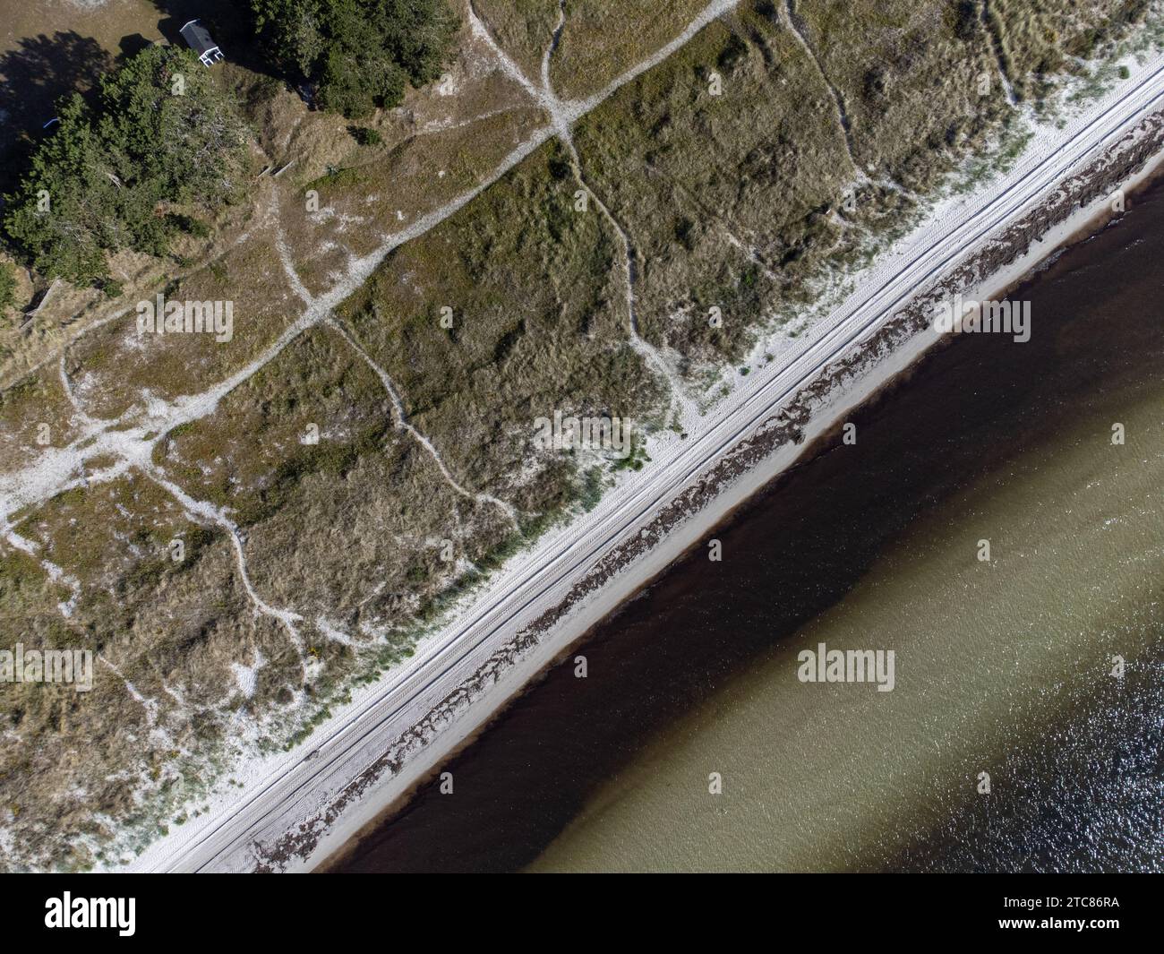 Aerial view of a tranquil landscape featuring a road winding through a ...