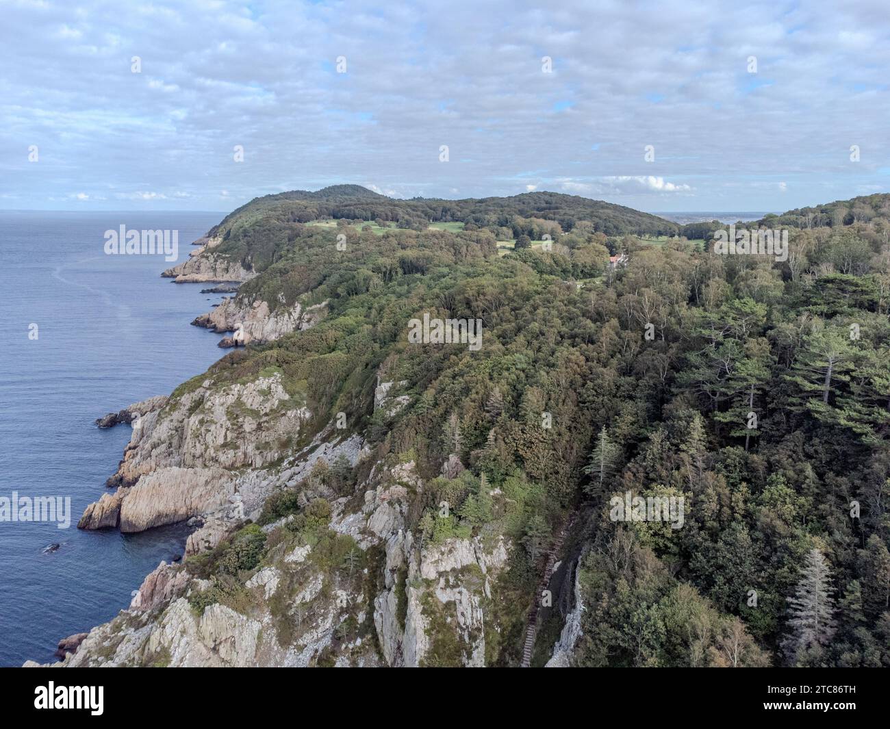 A serene landscape featuring a tranquil lake surrounded by majestic ...