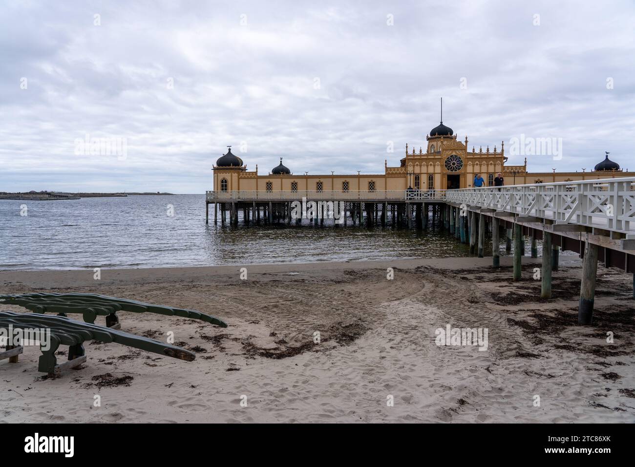 Two wooden benches facing the ocean on a beach in Varberg, Sweden Stock ...