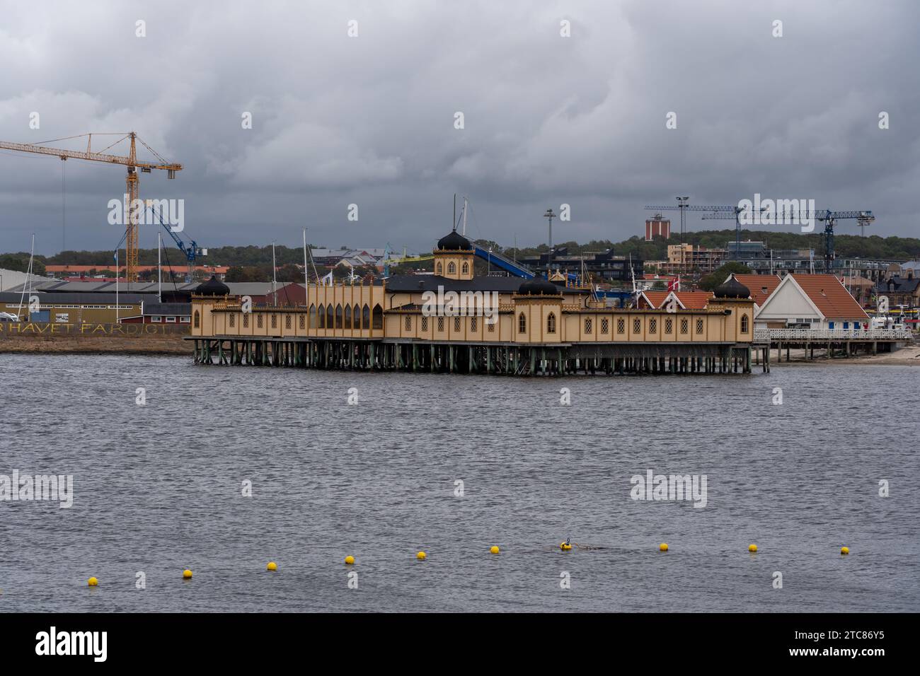A picturesque view of a marina filled with boats of various sizes and ...