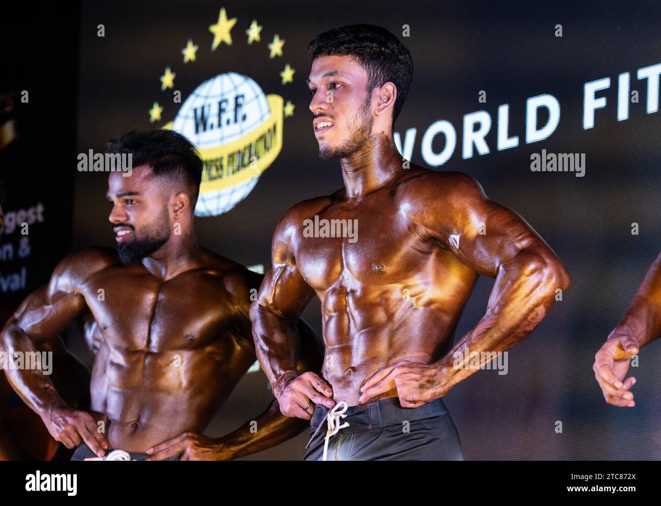 Guwahati, Assam, India. 10th Dec, 2023. Bodybuilders perform onstage ...