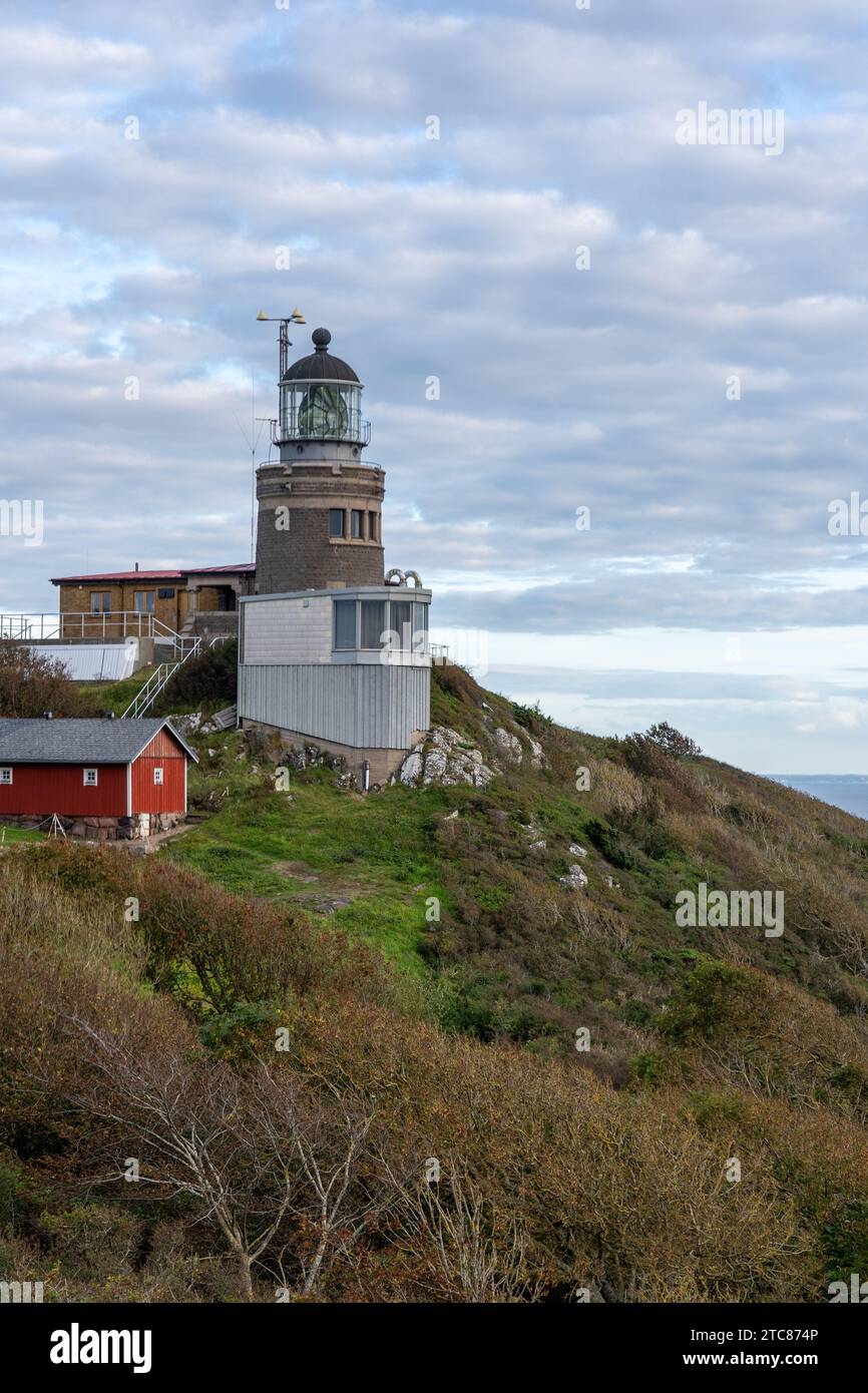 A scene of a majestic lighthouse perched on a hilltop with a ...