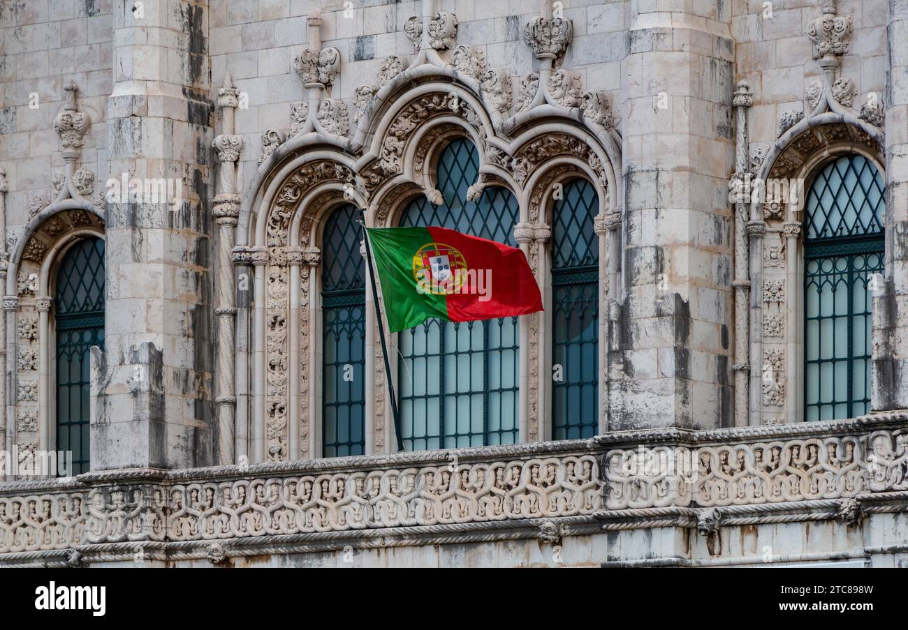 A picture of the Portuguese flag in the facade of the Jeronimos ...