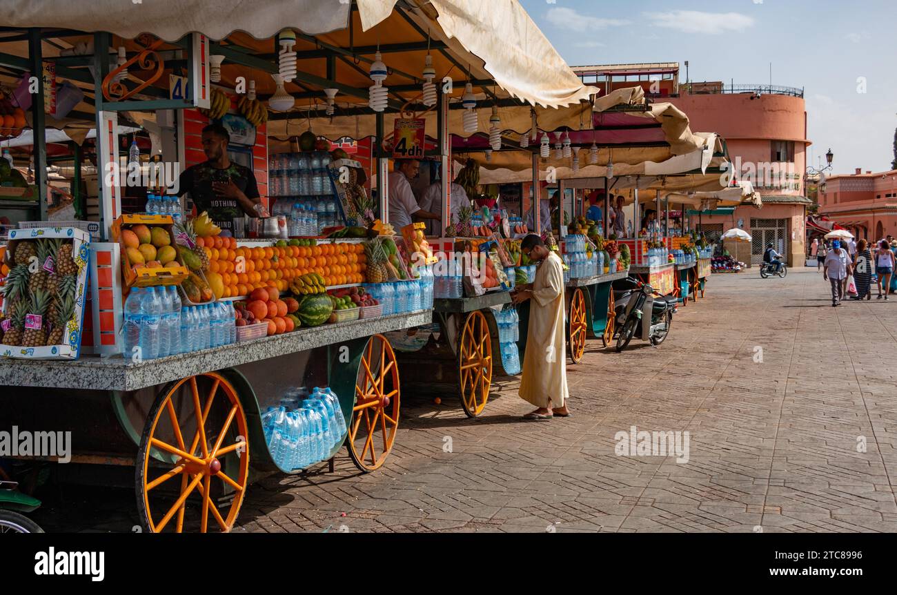 A picture of the colorful food stands that populate the Jemaa el-Fna ...