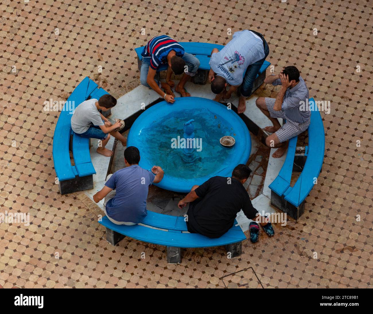 A picture of the muslim cleansing ceremony performed by men in ...