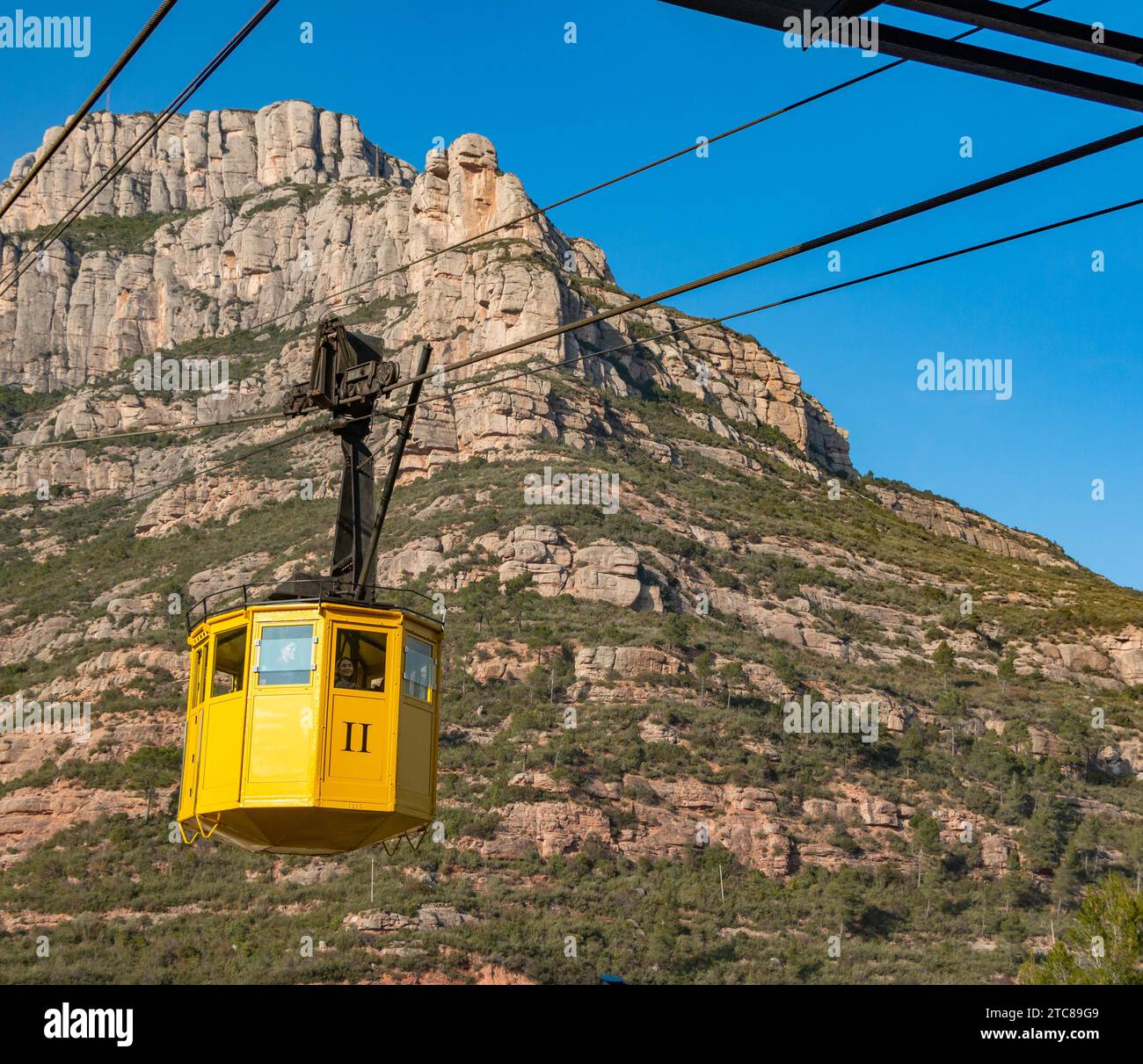 A picture of the cable car that takes people to the Montserrat mountain ...