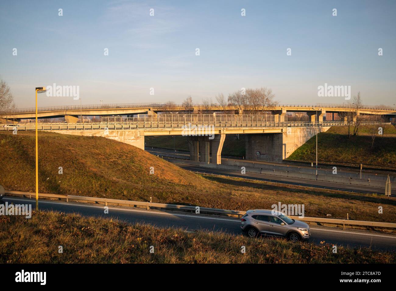 a motorway connection with overpass, which synergistically unites the ...