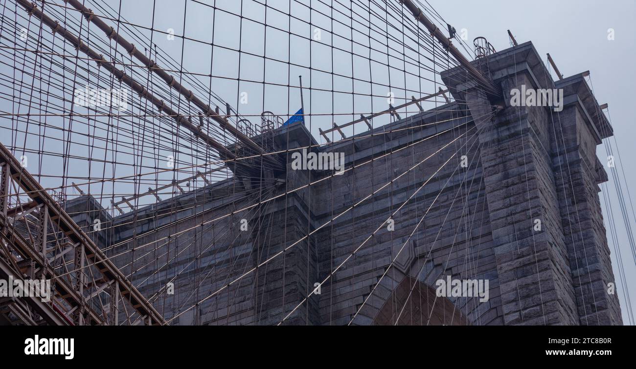 Historic icon of New York, the Brooklyn Bridge is a web of cables ...