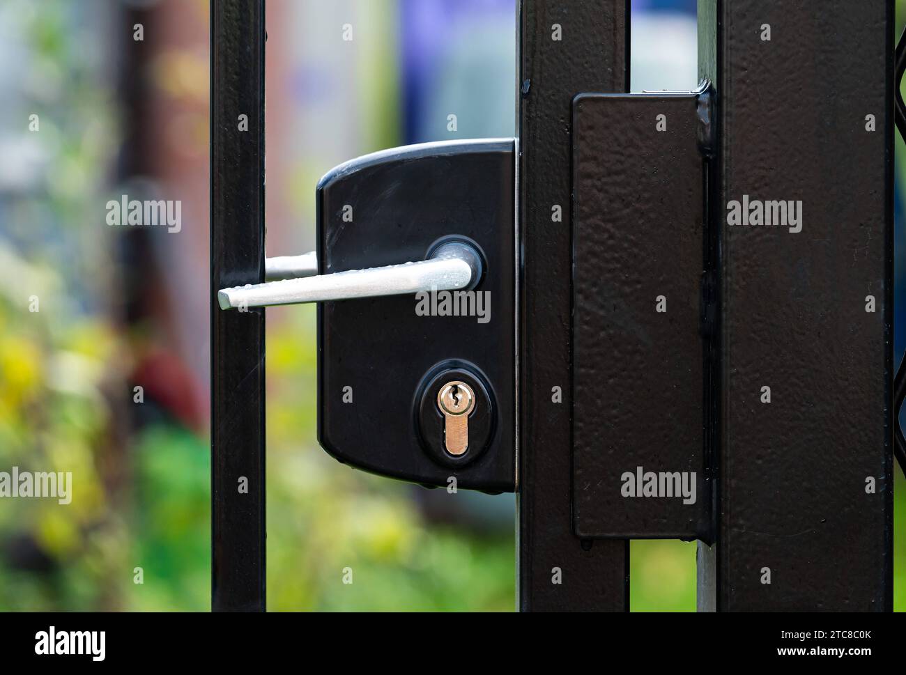 Door handle and lock of a metal fence, Brussels, Belgium Credit: Imago ...