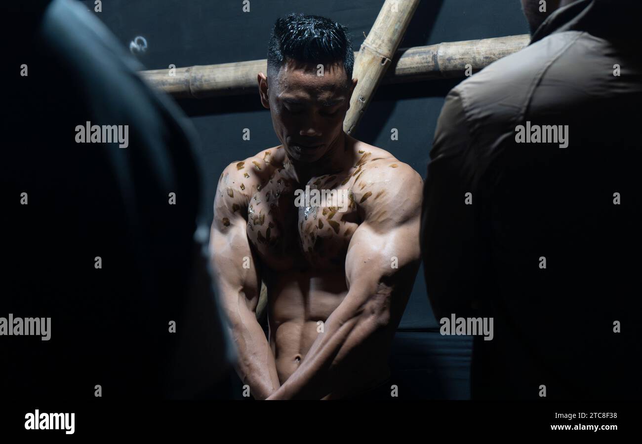 December 10, 2023: Participants gets their body painted with tanning ...