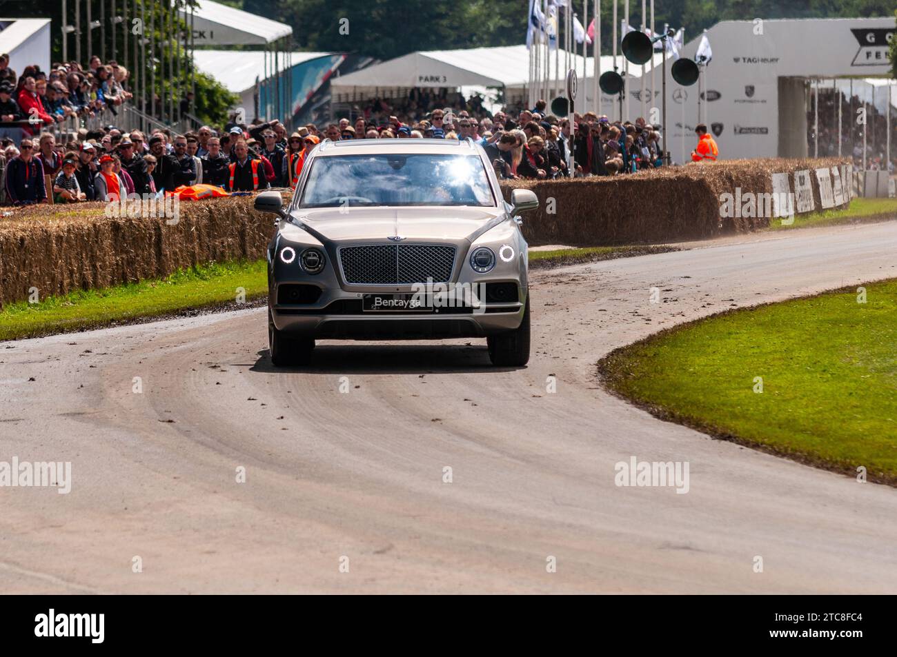 Bentley Bentayga luxury SUV car driving up the hill climb track at the ...