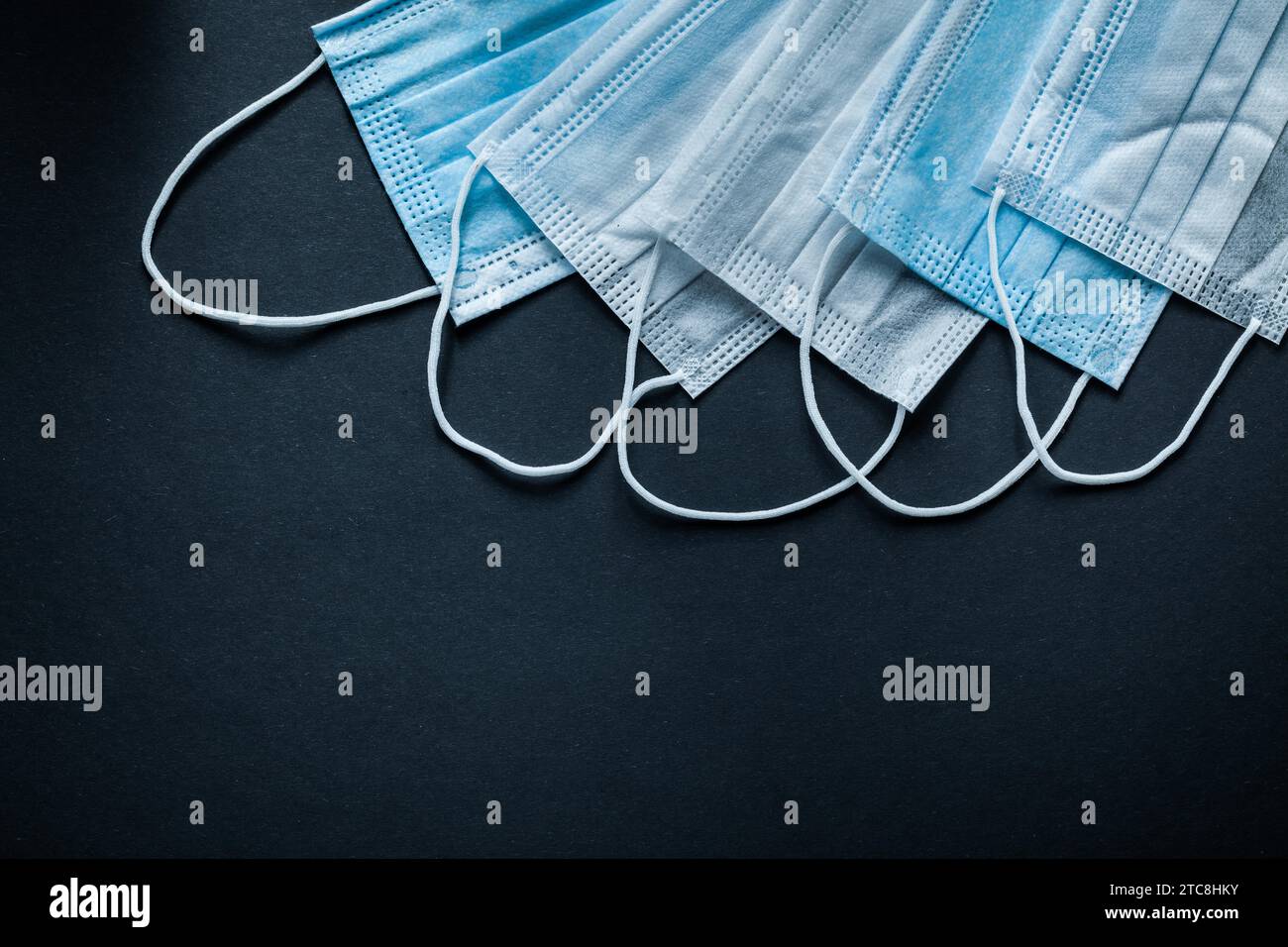 Disposable protective sterile masks on black background Stock Photo - Alamy