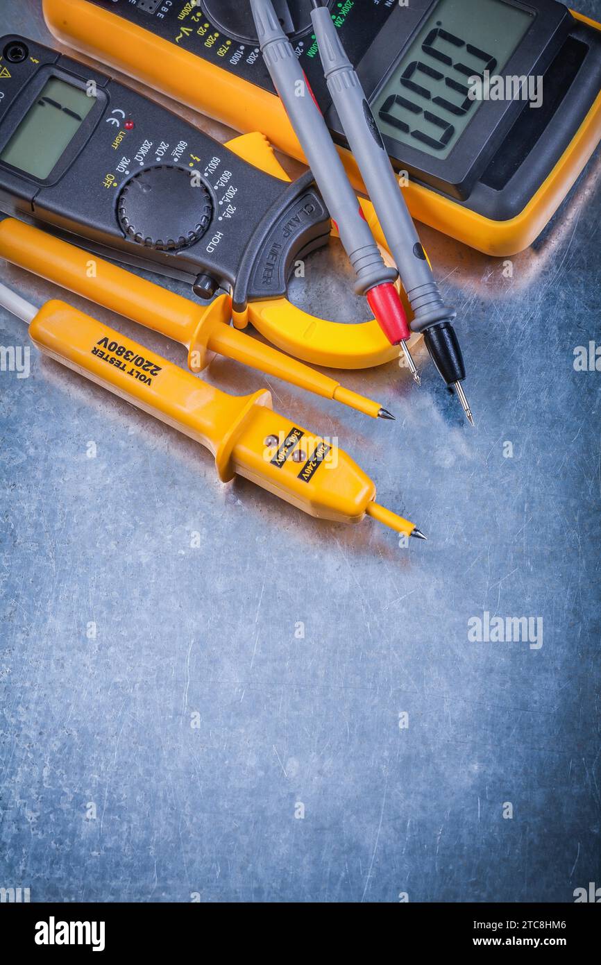 Digital ammeter electrical tester multimeter on metallic background ...