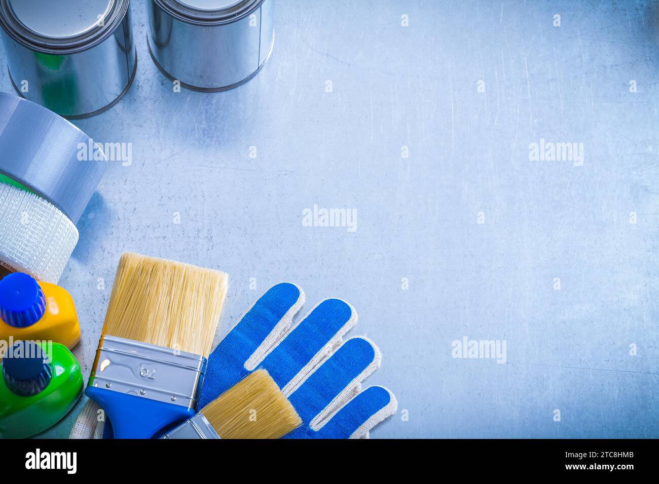Copy space image of construction paint tools on metallic background ...