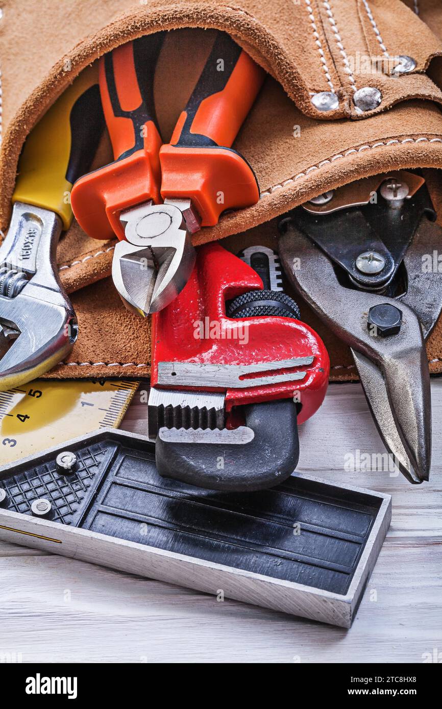 Leather construction belt with tooling on wooden board maintenance ...