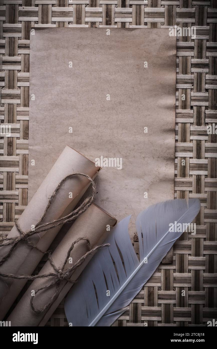 Medieval blank sheet rolled paper feather on wicker wooden mat Stock ...