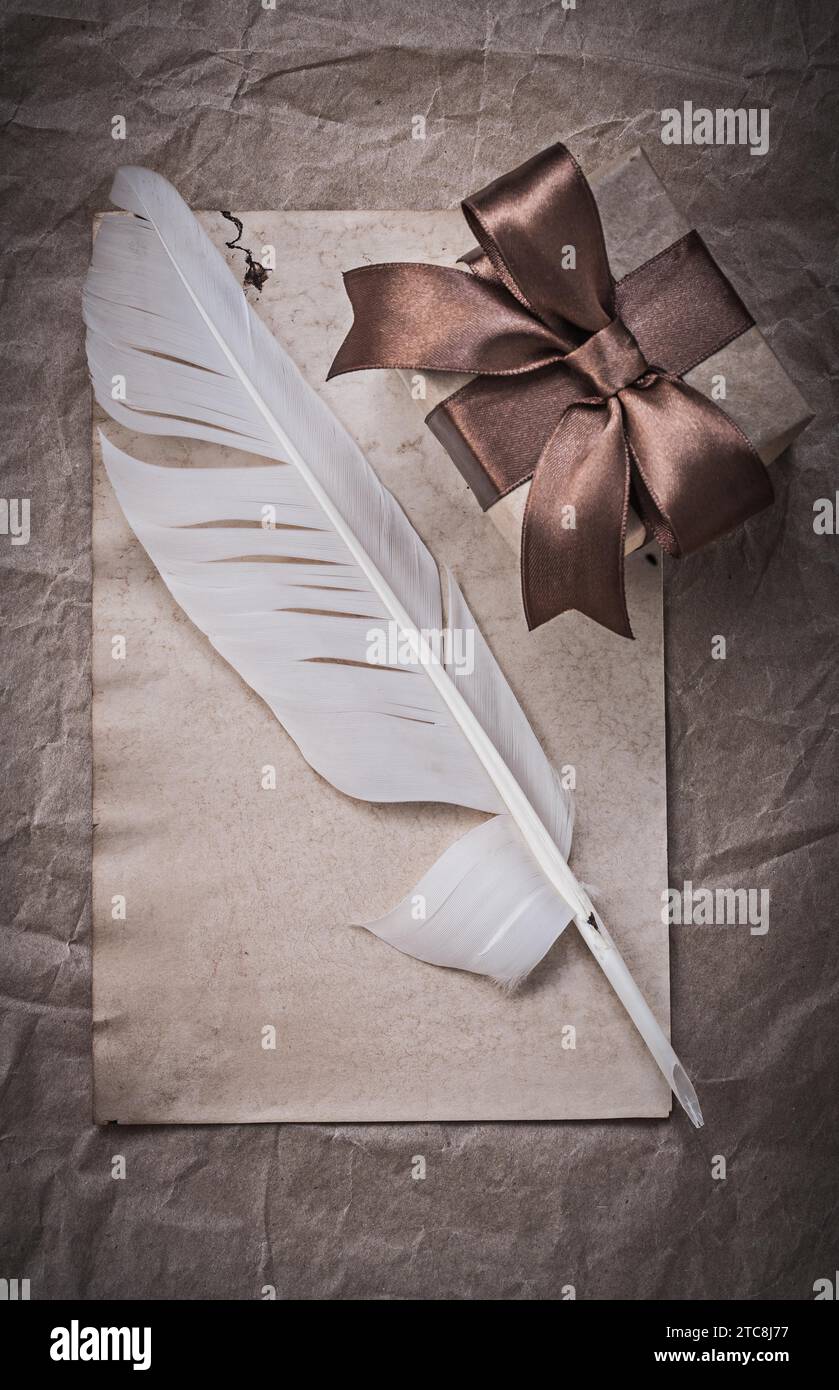 Present boxes sheet of wrapping paper feather celebration concept Stock ...