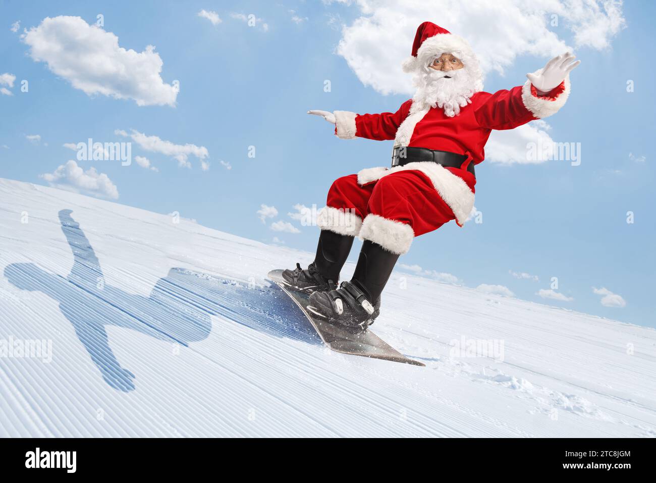 Santa claus riding a snowboard at a mountain Stock Photo - Alamy