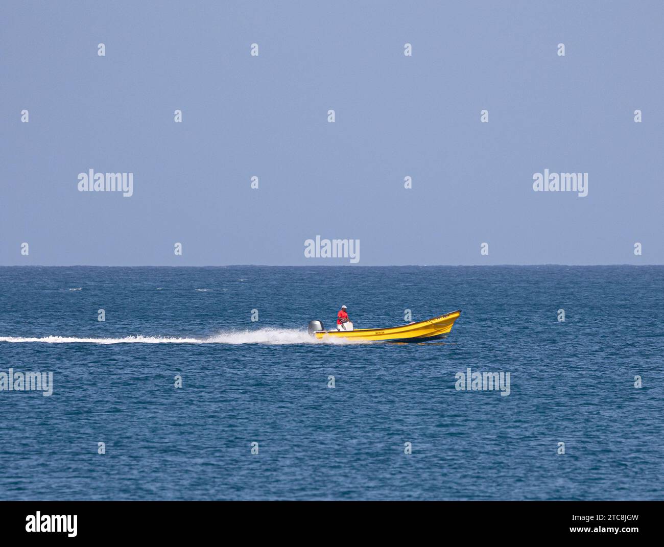 A small vessel navigating through the turbulent waters of the ocean ...