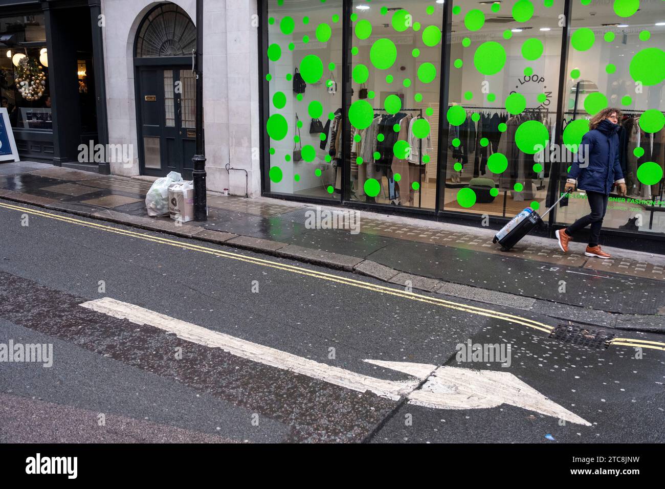 Green spots on the widows of a pop up store by Loop Generation offering ...