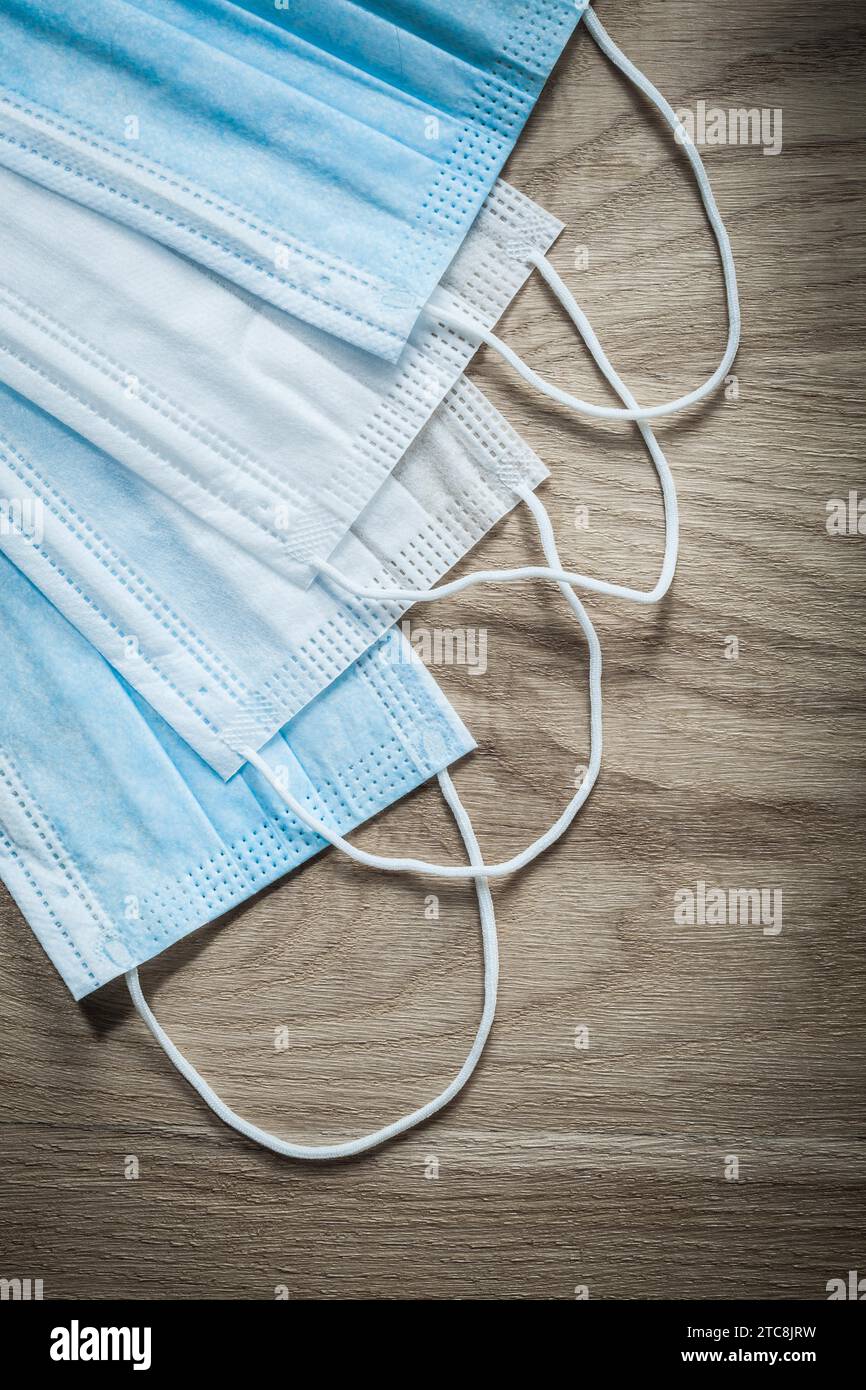 Set of face sterile masks on wooden board Stock Photo - Alamy