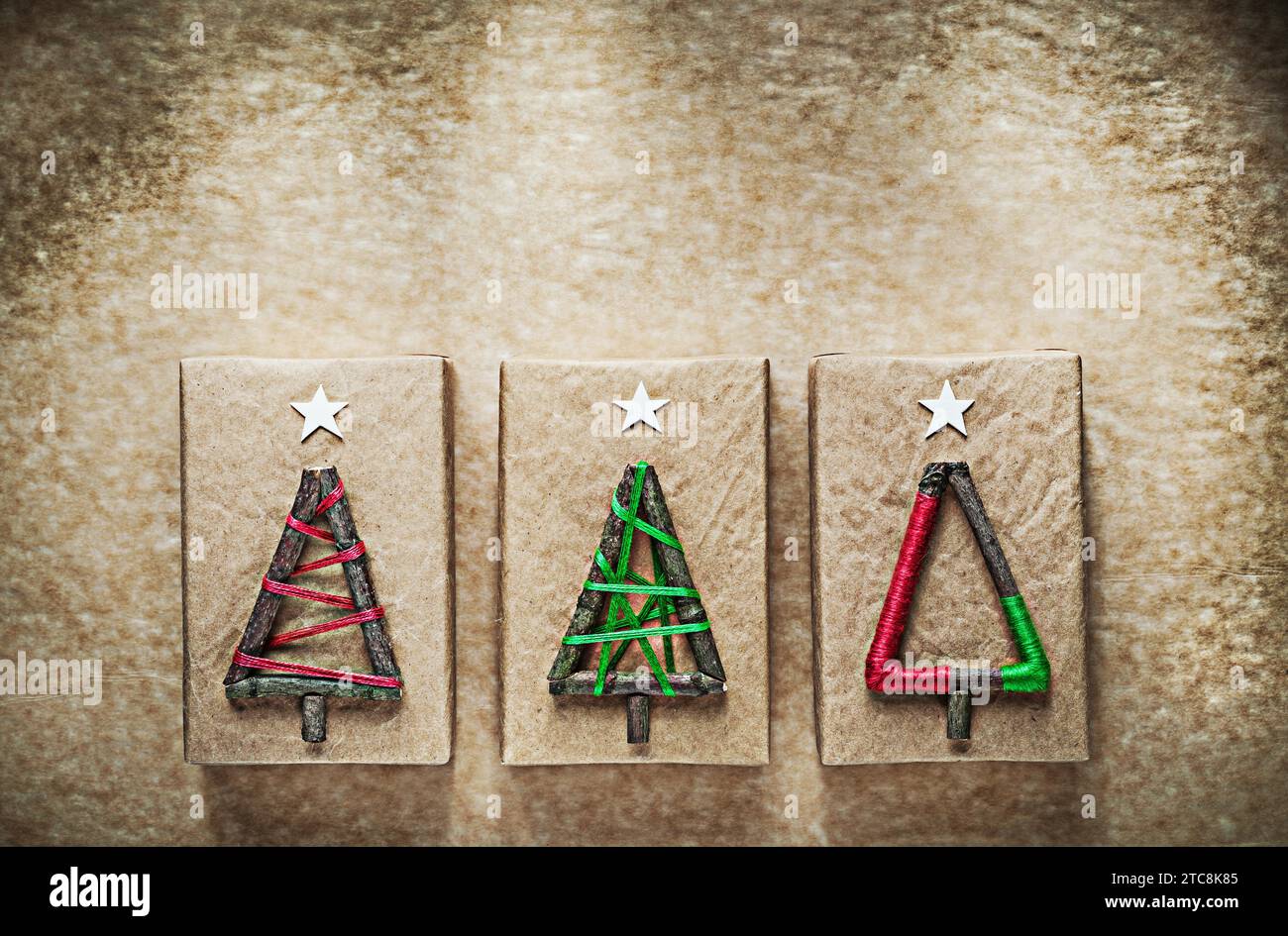 Christmas gift boxes on crumpled vintage paper Stock Photo - Alamy