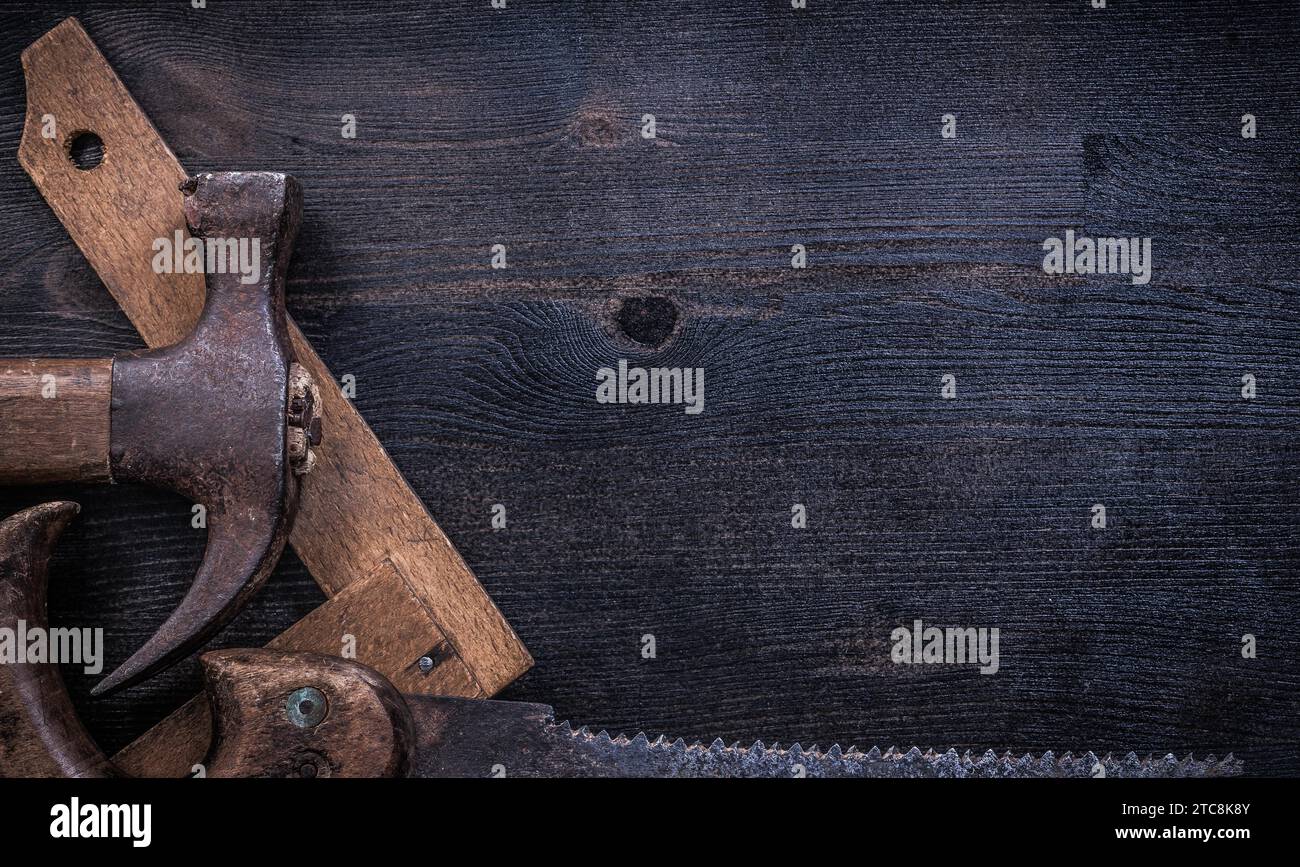 Collection of vintage rough construction tools on wooden board Stock ...