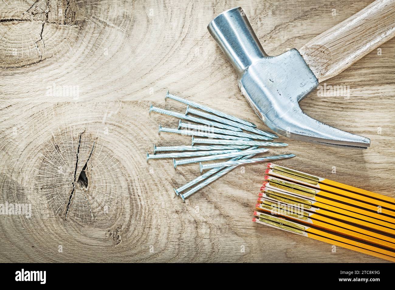 Claw hammer wooden meter construction nails on wood board top view ...