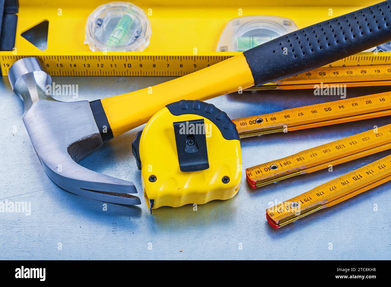 Construction level tape line claw hammer wooden meter on metallic ...