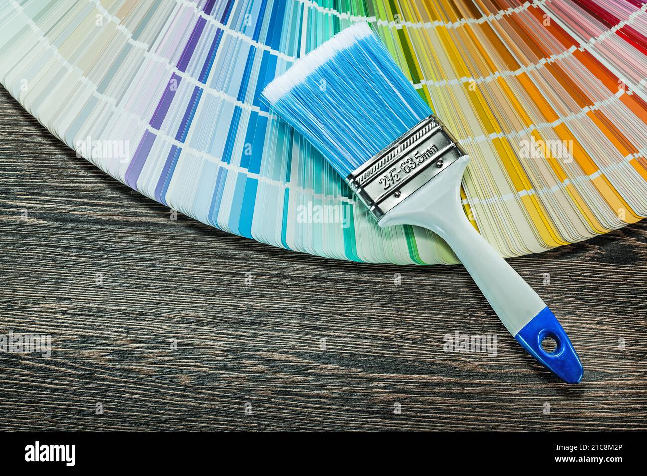 Paintbrush color palette on wood board Stock Photo - Alamy