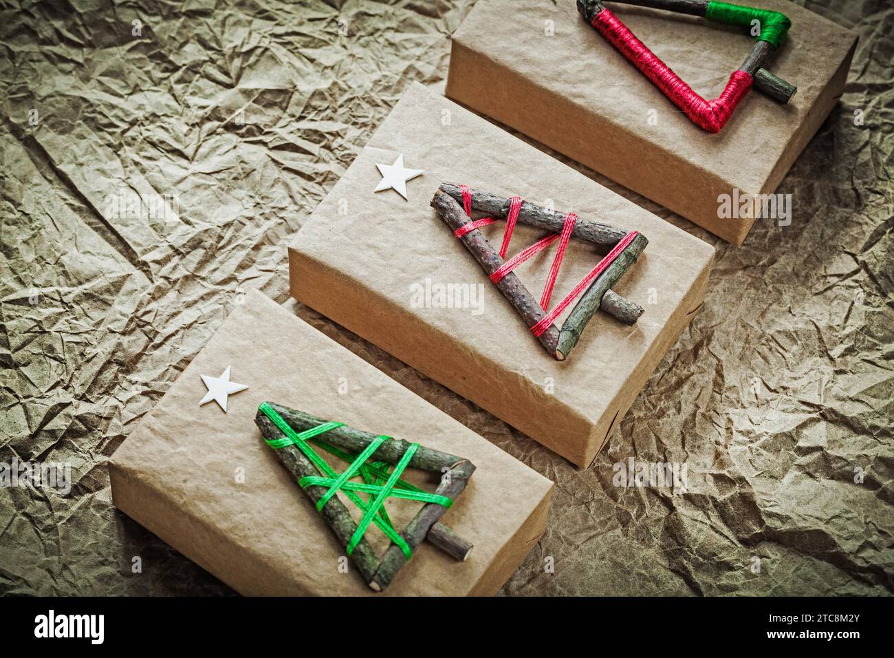 Packaged Christmas handmade gift boxes on crumpled vintage paper Stock ...