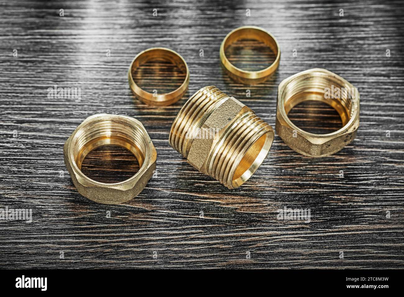 Pipe connectors on vintage wooden board Stock Photo - Alamy