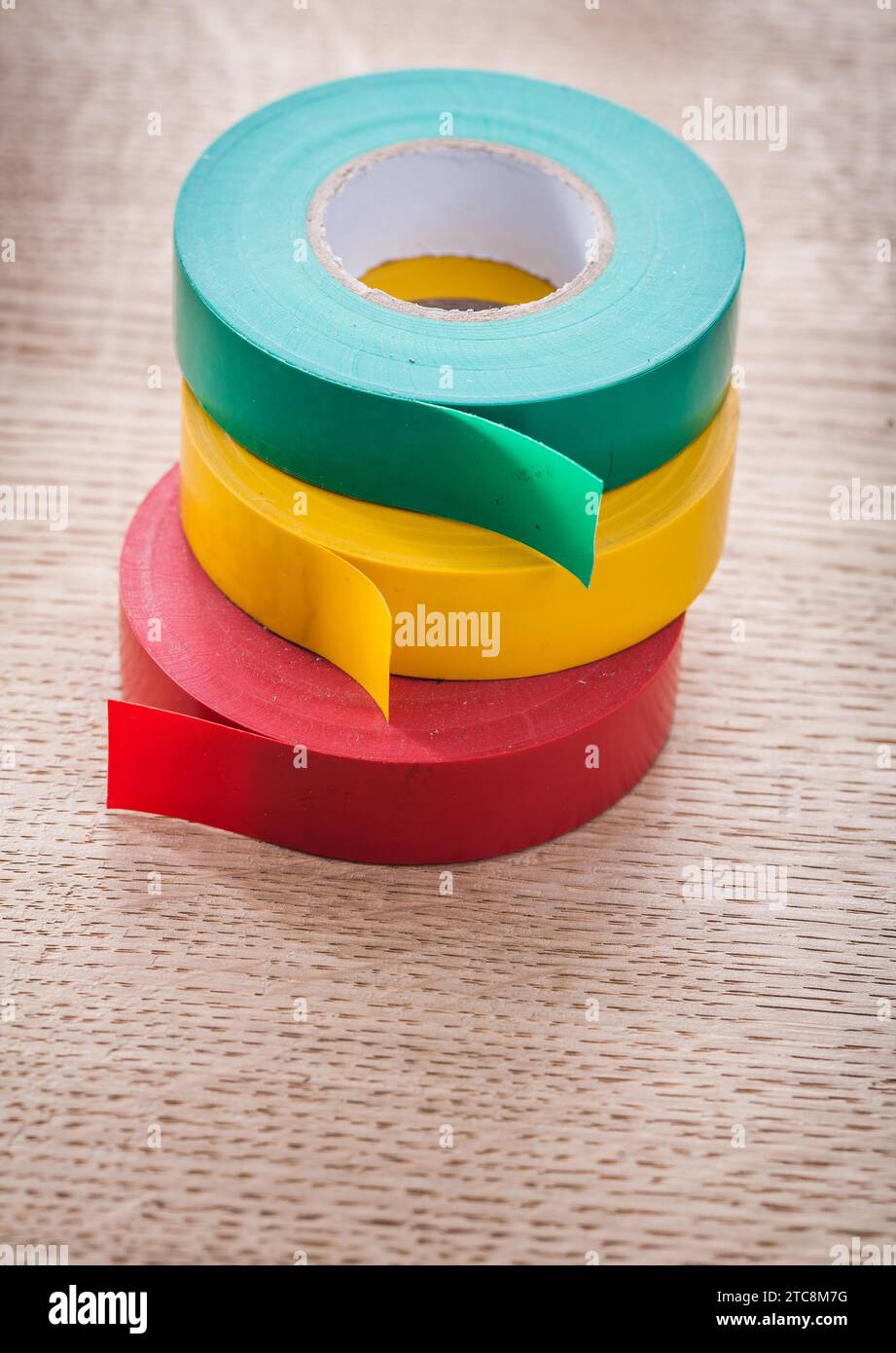 Rolls of insulating tapes on wooden board electricity concept Stock ...