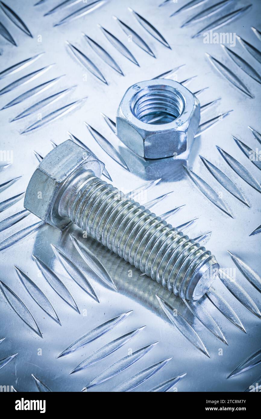 Screwbolt threaded screw-nut on corrugated metal plate construction ...